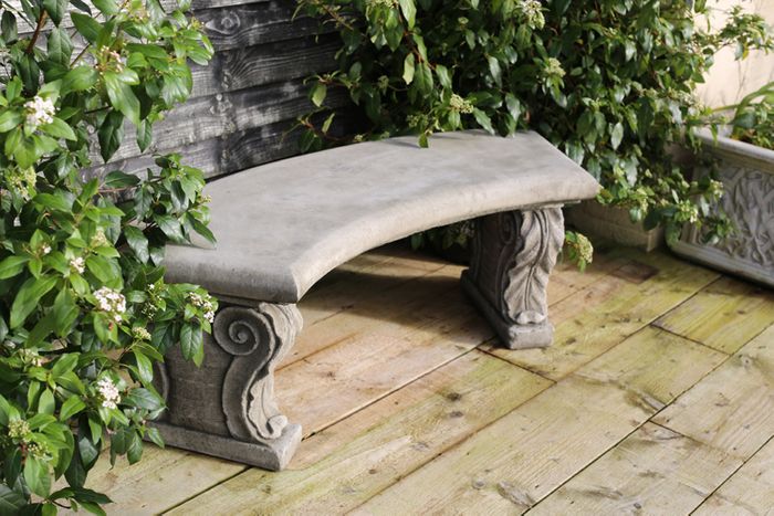 Curved garden bench stone store